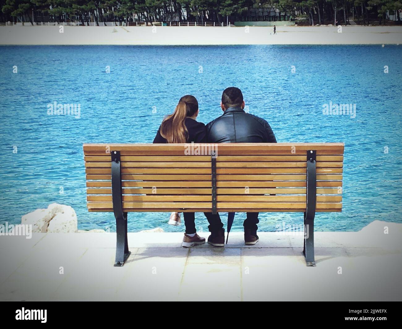 People sitting bench in front lake park bench hi-res stock photography ...