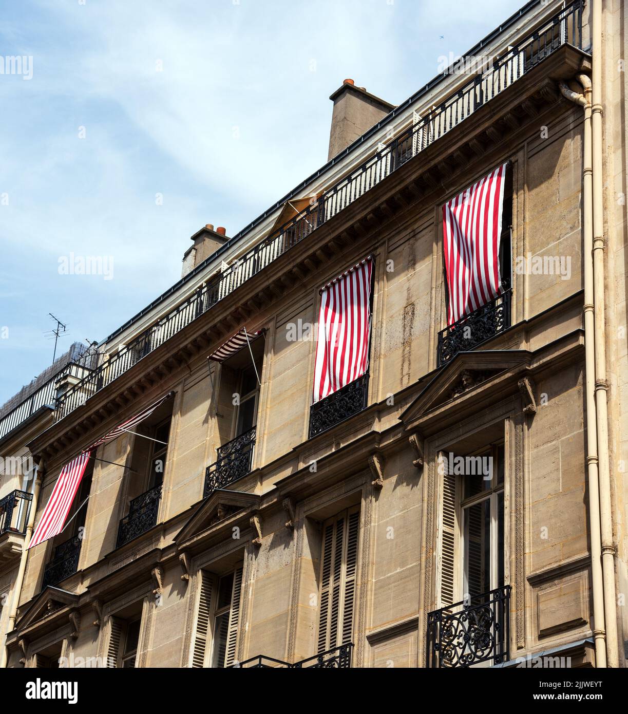 Summer in Paris. Striped sun shade over window. Architectural detail ...