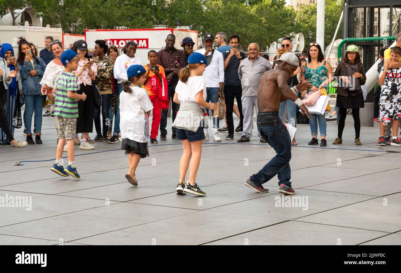 PARIS, FRANCE - JUNE 24, 2018: Parisian urban scene. Multicultural ...