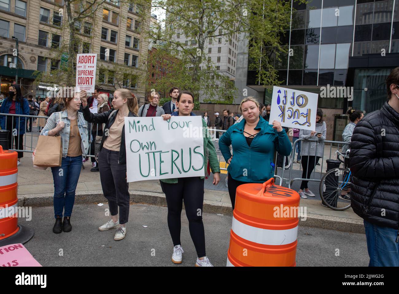 A young female holding a cardboard sign at Foley Square, New York, NY ...
