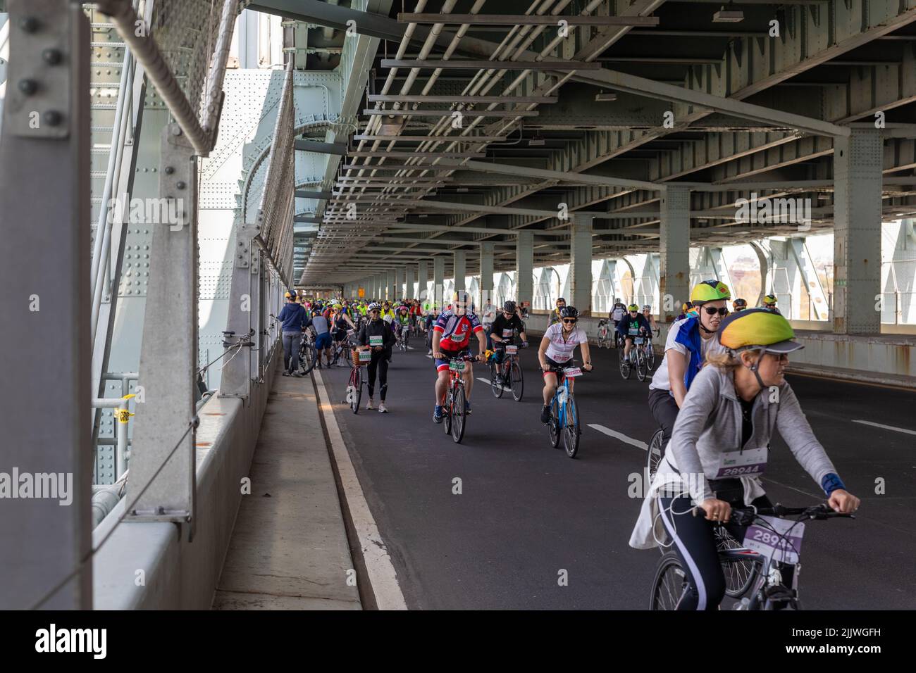 A closeup shot of bikers participating in the Five Boro Bike tour in ...
