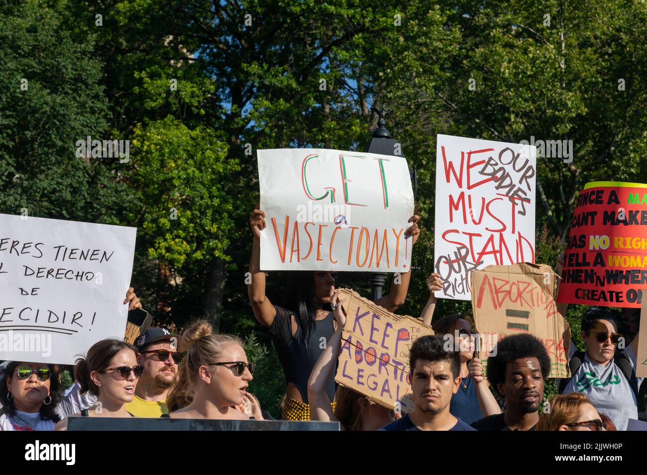 The protesters holding cardboard signs after Supreme Court Overturned ...