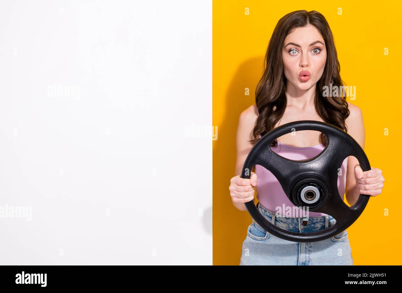 Photo of surprised person hold wheel pouted lips stare camera empty ...