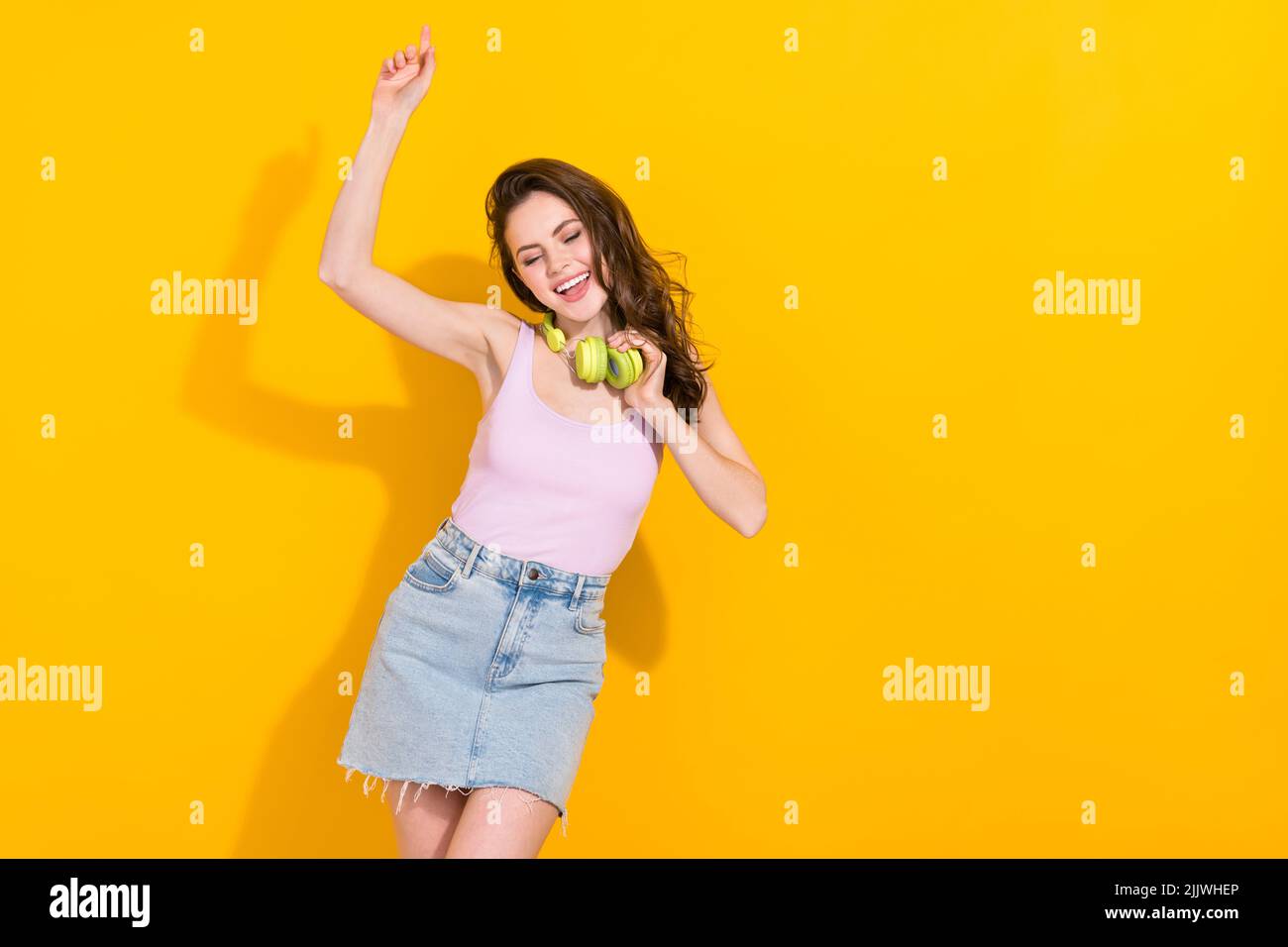 Photo of positive pretty girl closed eyes dancing point finger enjoy ...