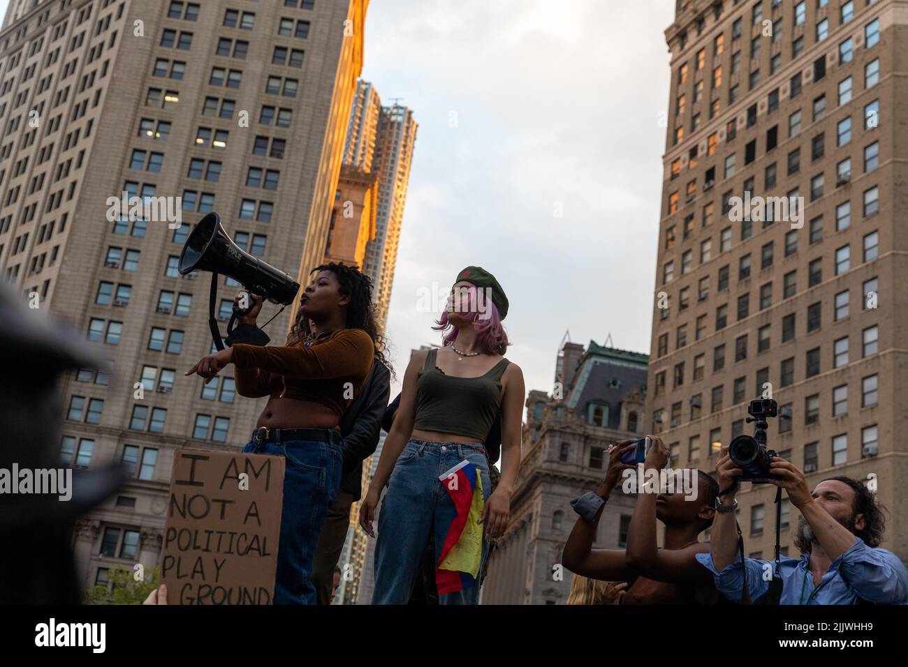 A crowd of protesters holding cardboard signs after the Supreme Court ...