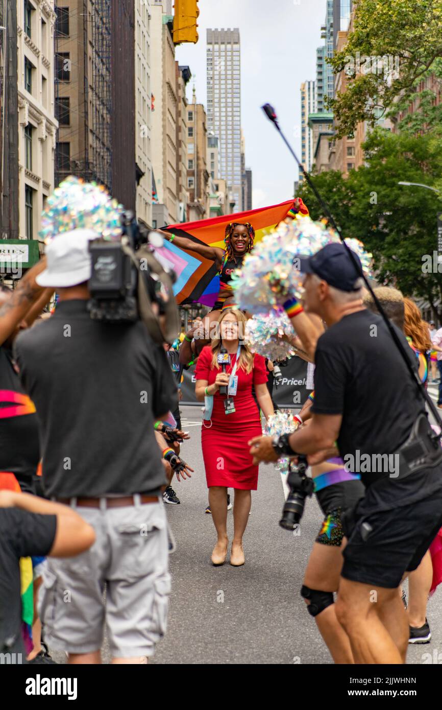A TV Host reporting about the Pride Month Parade 2021 on the streets of ...