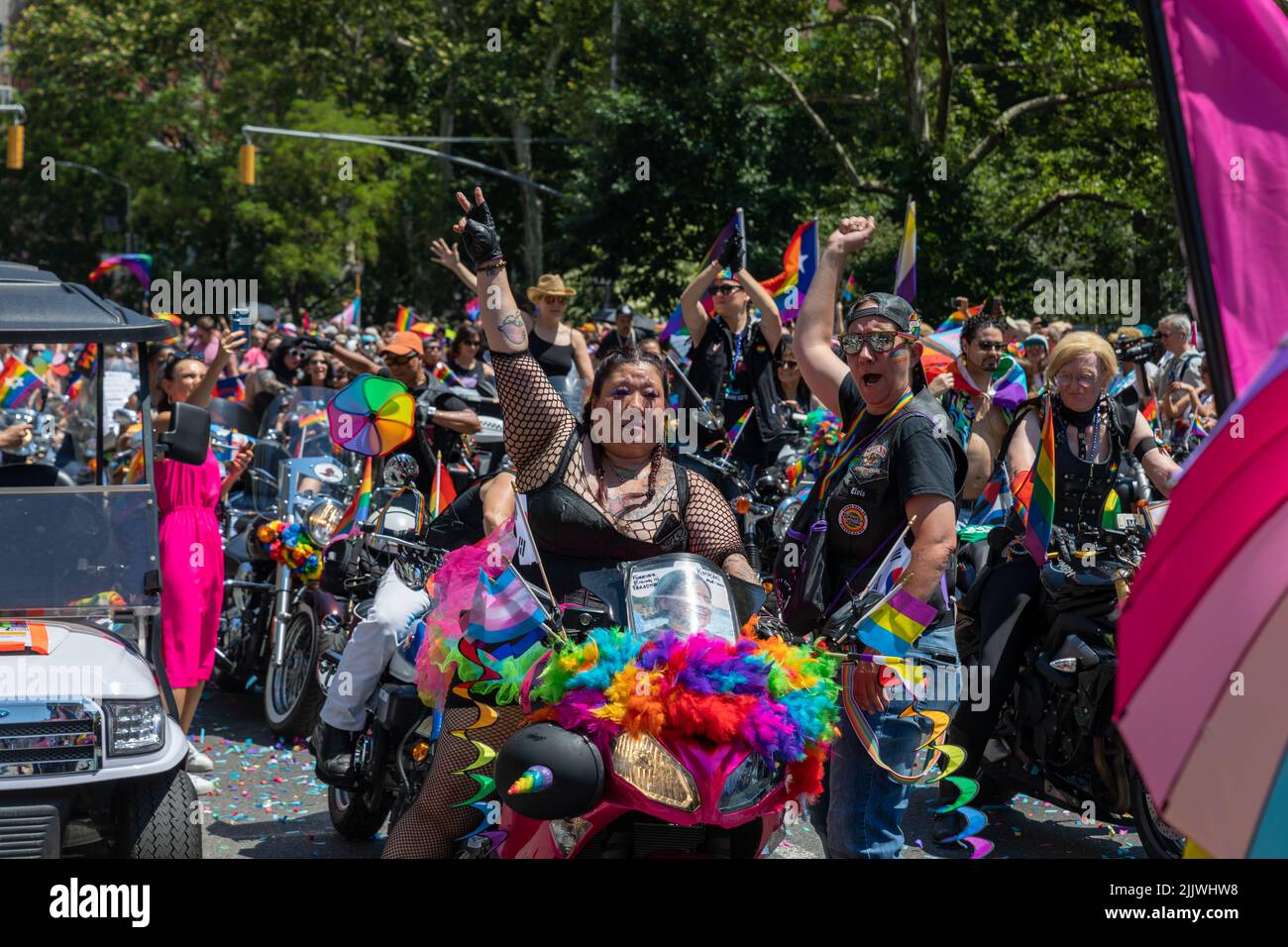 A group of people on motorcycles celebrating the Pride Parade in New ...