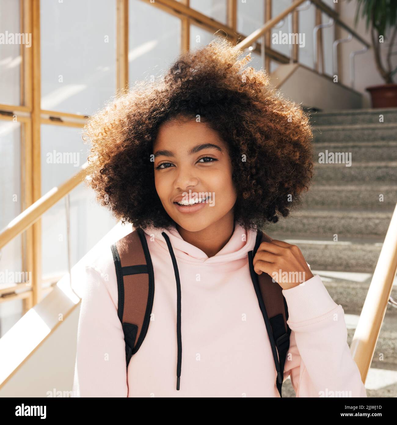 Portrait of a beautiful girl standing in high school Stock Photo - Alamy