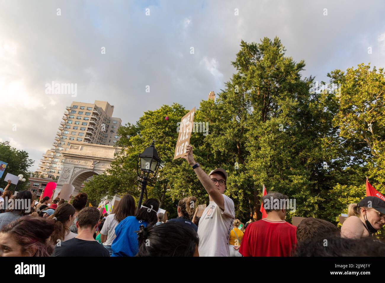 The protesters holding cardboard signs after Supreme Court Overturned ...
