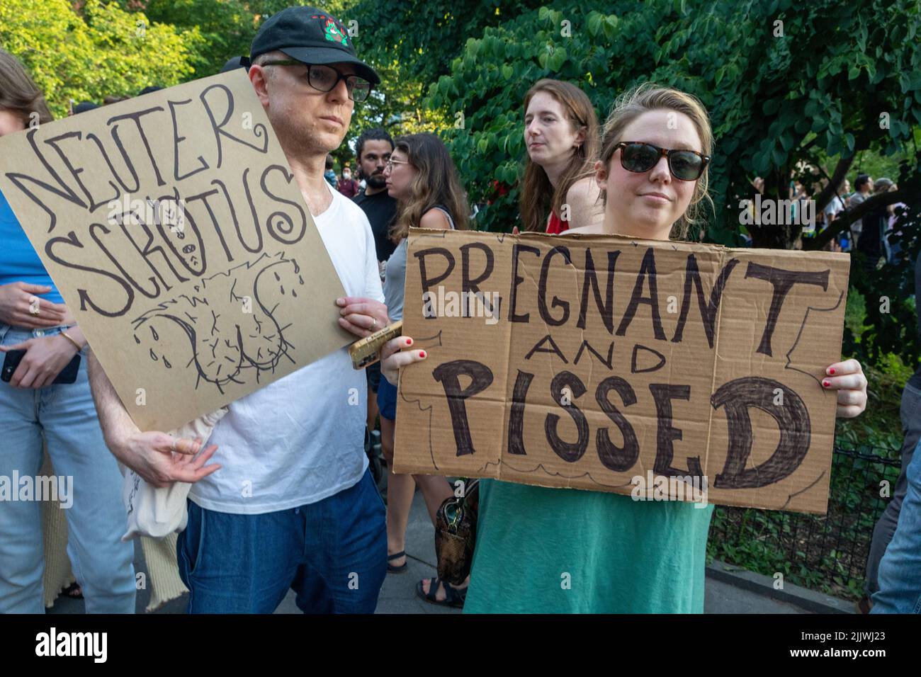 The protesters holding cardboard signs after Supreme Court Overturned ...