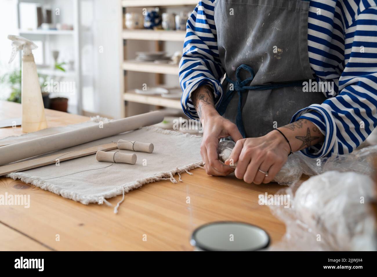 Artisan female work in studio on handicraft jar production for handmade ...