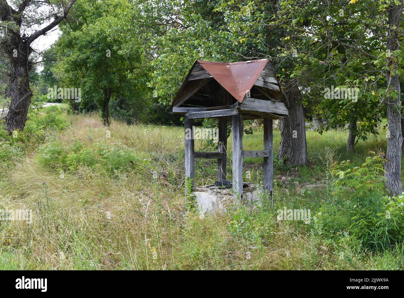 Old wooden well in fall hi-res stock photography and images - Alamy