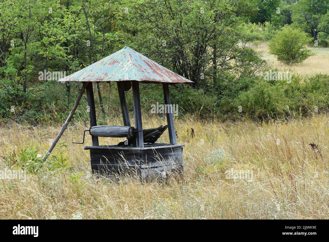 Old wooden well in fall hi-res stock photography and images - Alamy