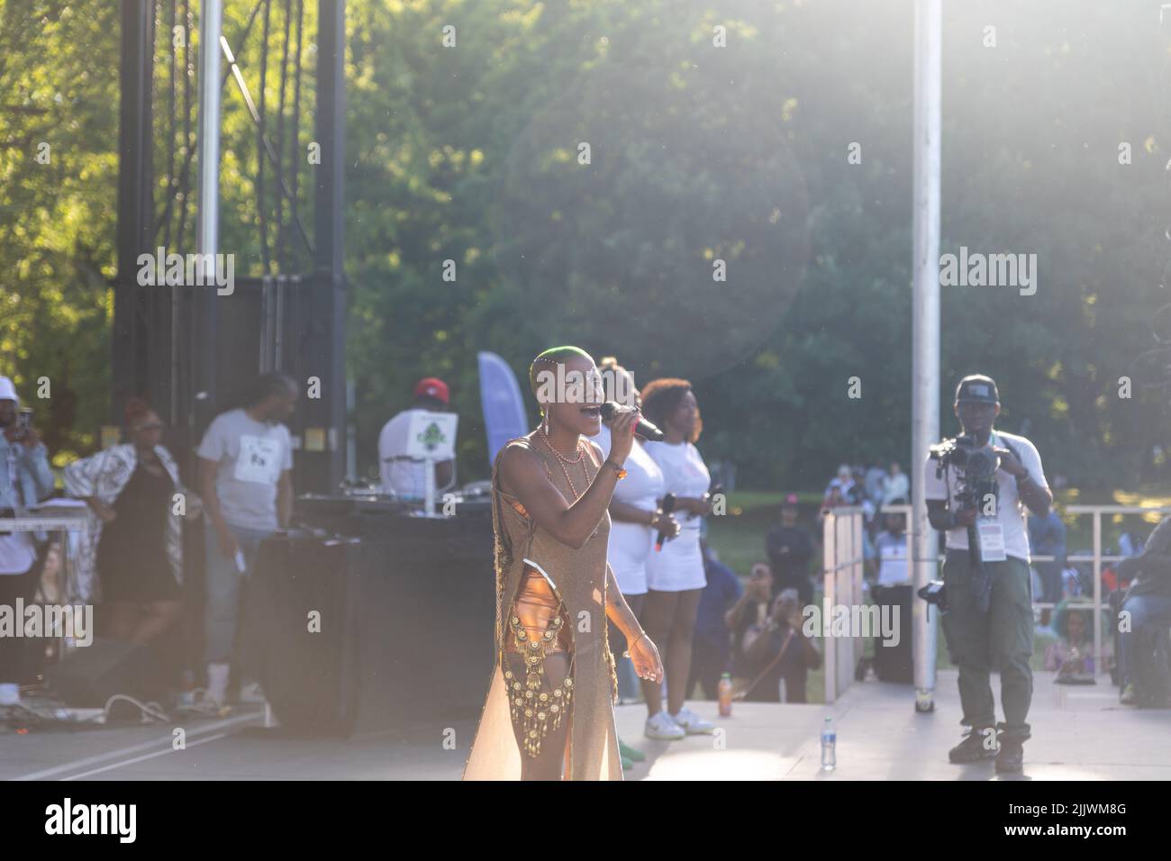 A closeup shot of a singer at the 13th Annual Juneteenth celebration in ...