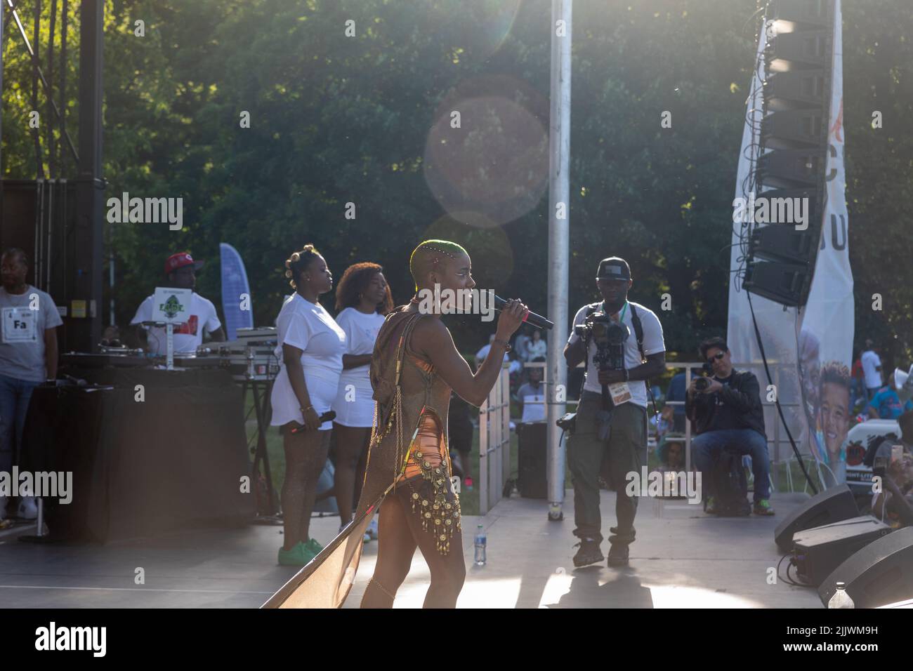 A closeup shot of a singer at the 13th Annual Juneteenth celebration in ...