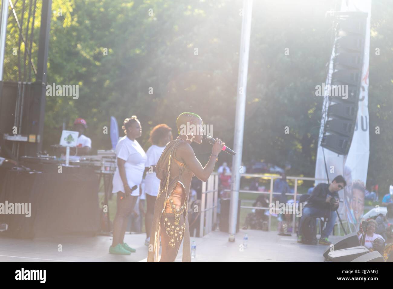 A closeup shot of a singer at the 13th Annual Juneteenth celebration in ...