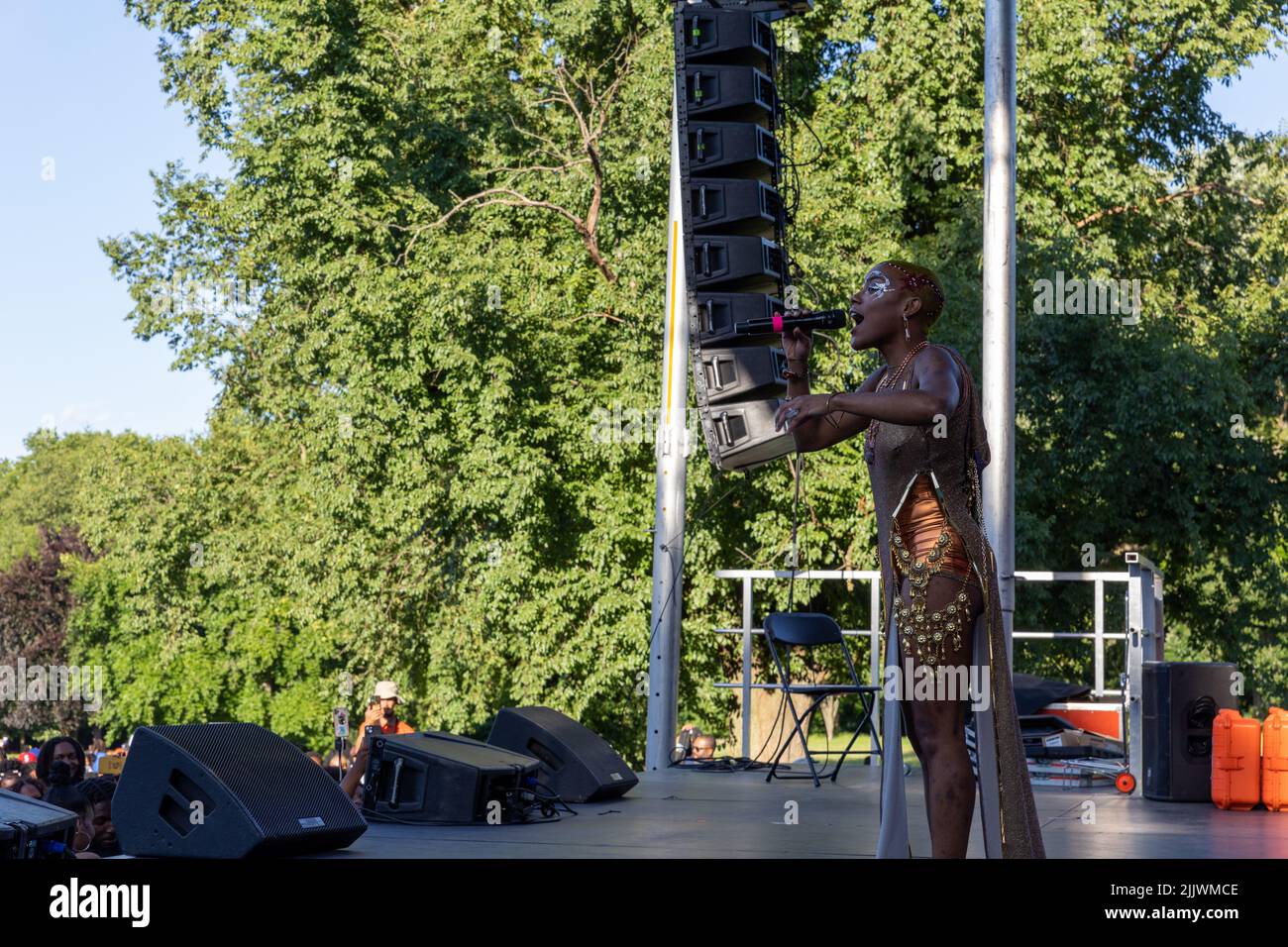 A closeup shot of a singer at the 13th Annual Juneteenth celebration in ...