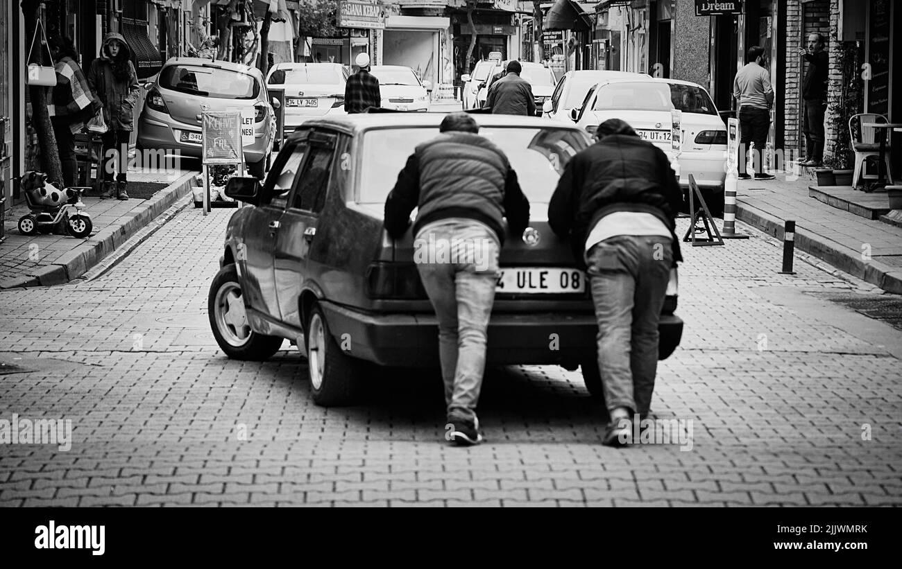 Pushing car Black and White Stock Photos & Images - Alamy