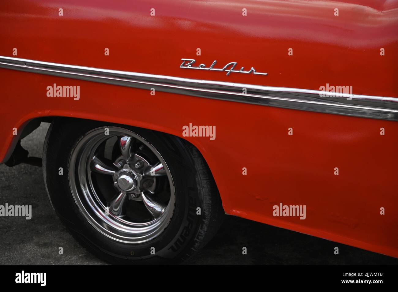 Vintage red 1950 Chevrolet Bel Air black side wall wheel with chrome ...