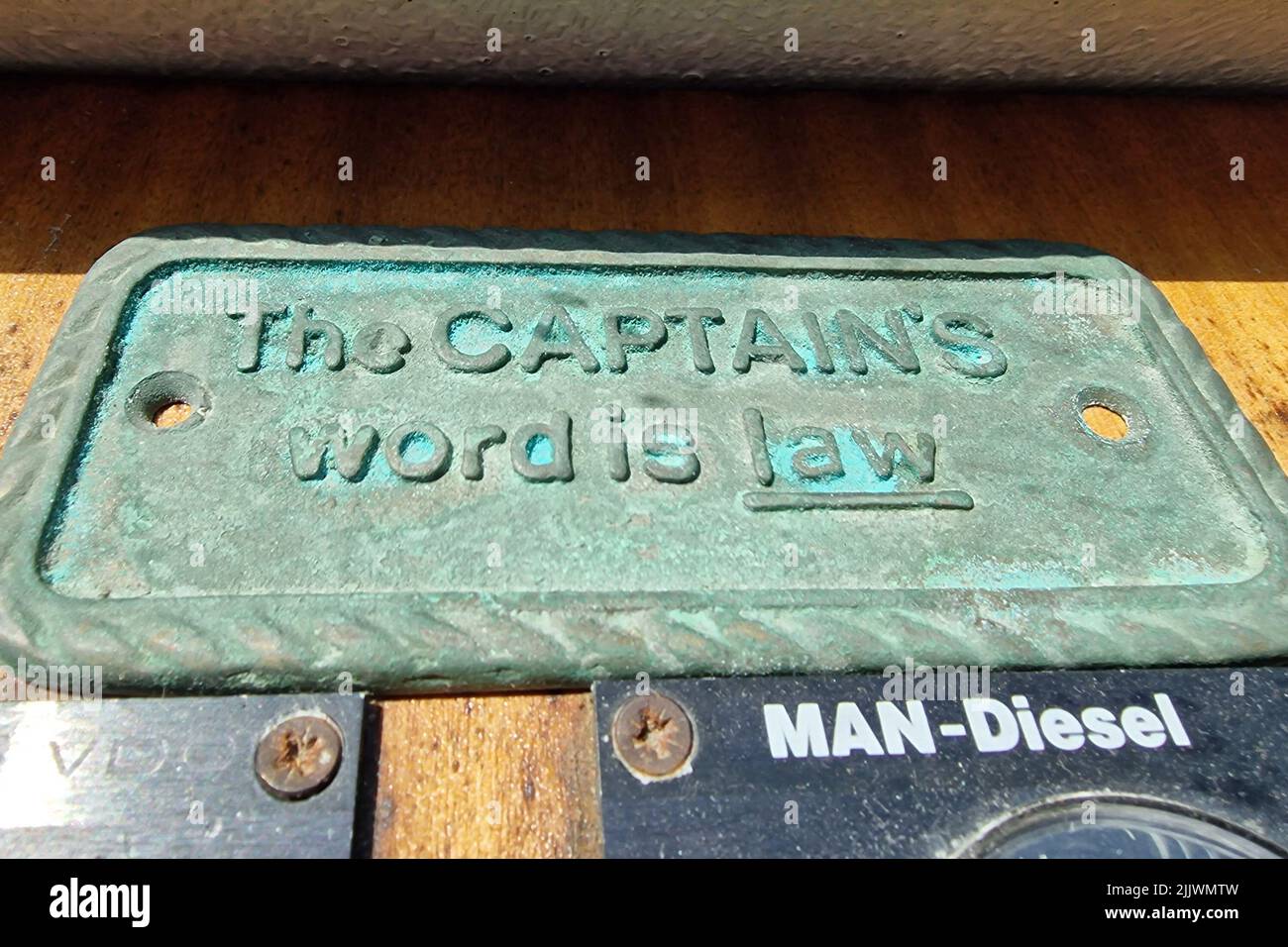 the captain word is law sign metal plaque Stock Photo - Alamy