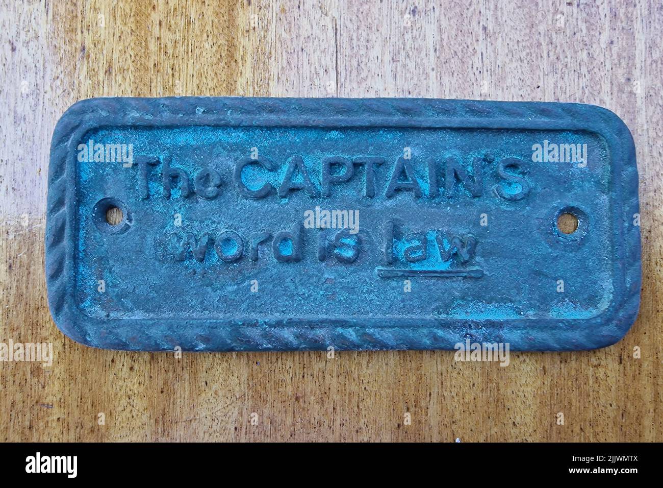 the captain word is law sign metal plaque Stock Photo - Alamy