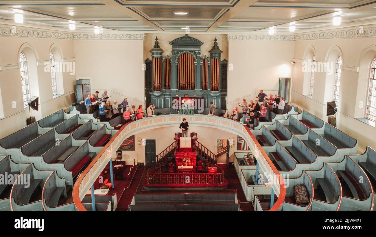 An interior of a church with singing choir in Leeds, United Kingdom ...