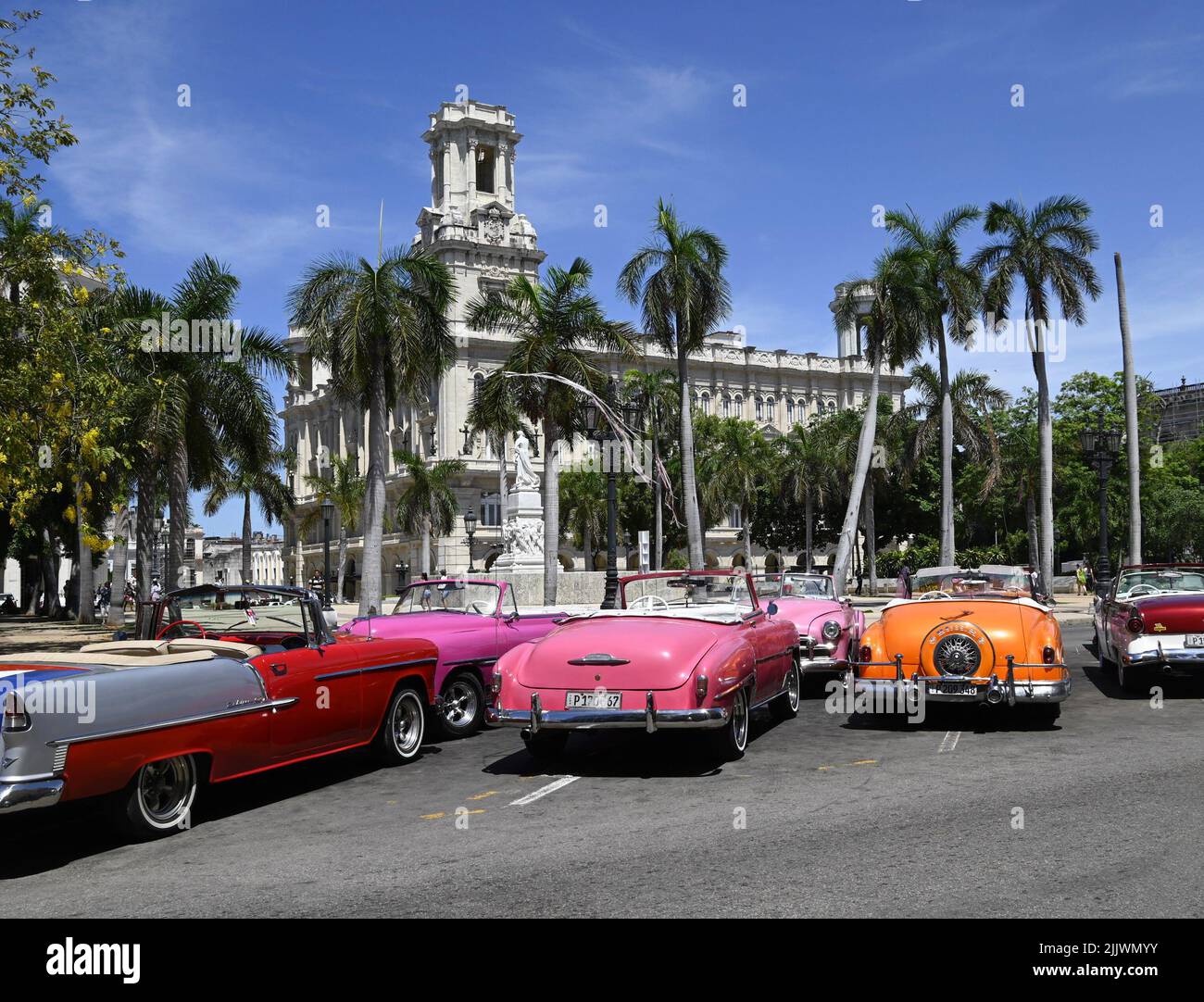 Vintage colorful Ford, Cadillac and Chevrolet antique convertible ...