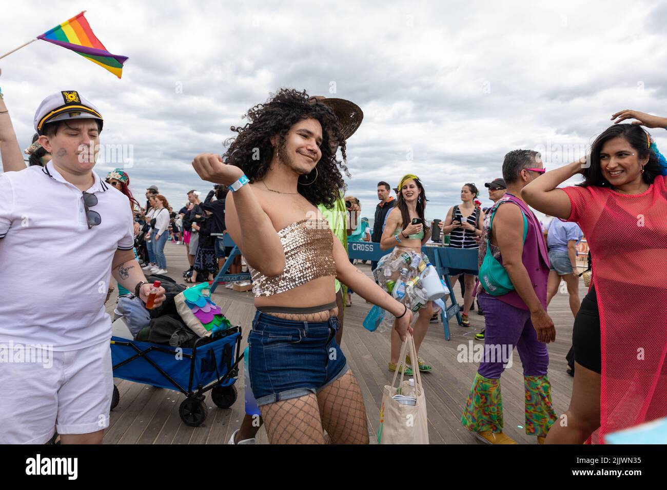 A young boy in a wig wearing a shiny top and shorts at the 40th Annual ...