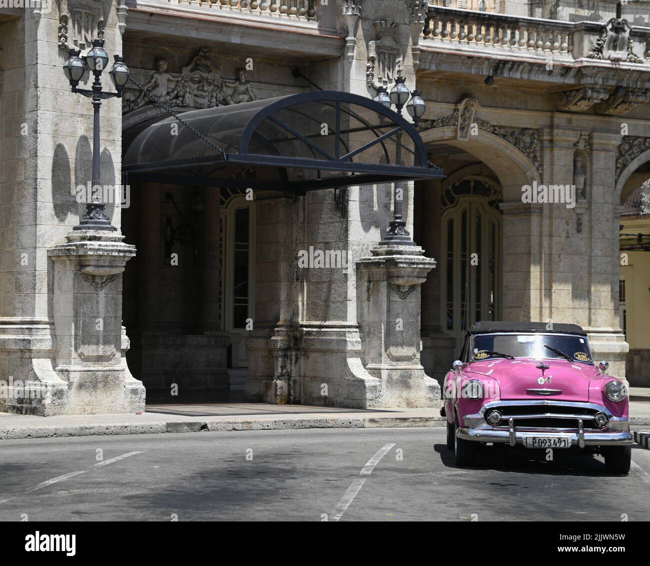 Vintage pink 1954 Chevrolet Bel Air convertible antique car with a ...