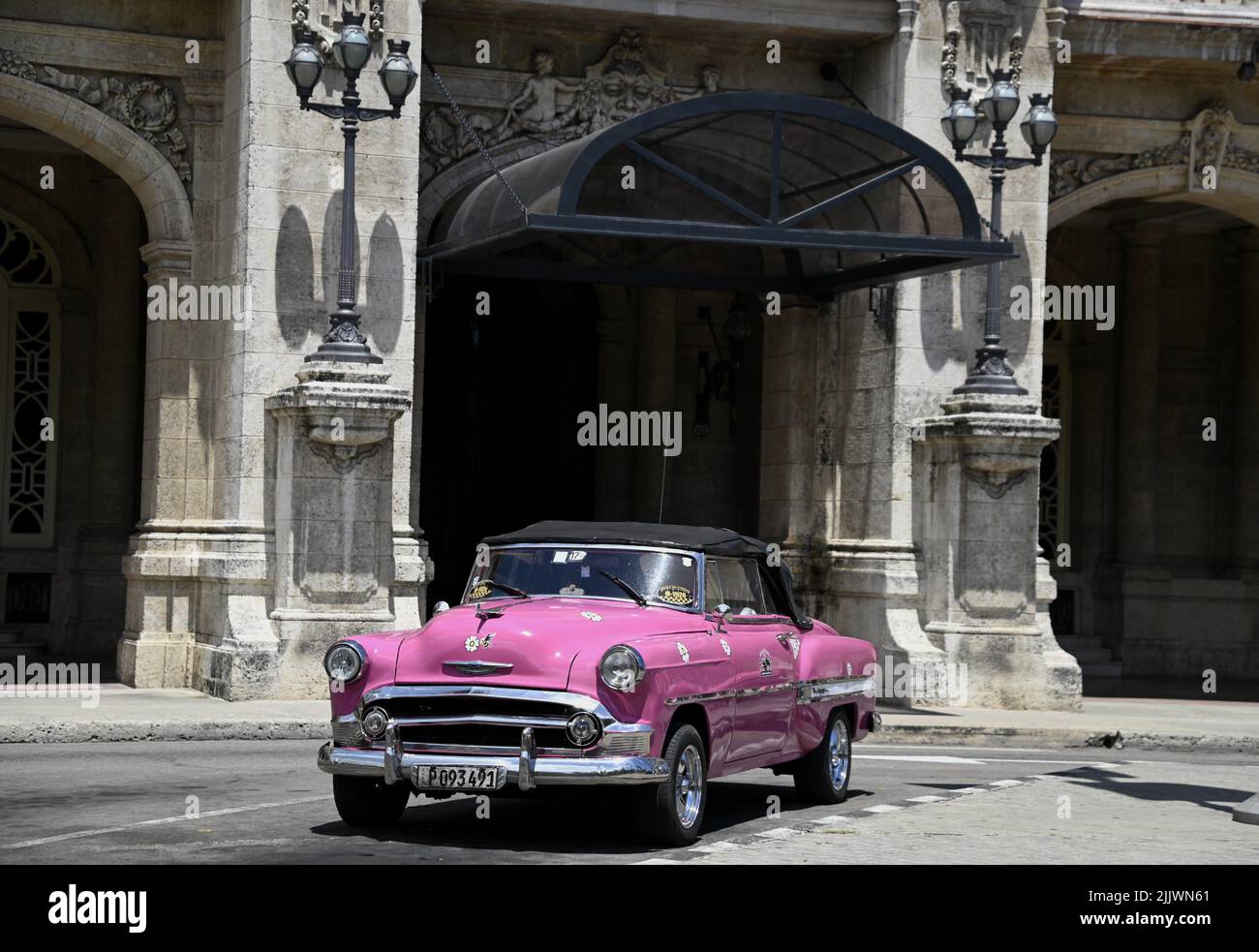Vintage pink 1954 Chevrolet Bel Air convertible antique car with a ...