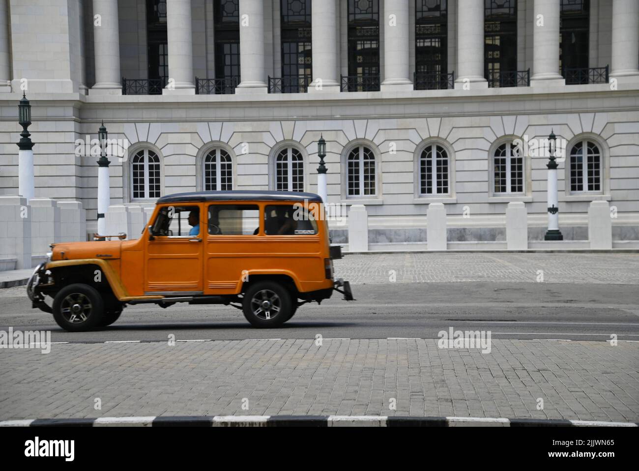 Vintage orange Jeep Willy with the Capitol in the background in Havana ...