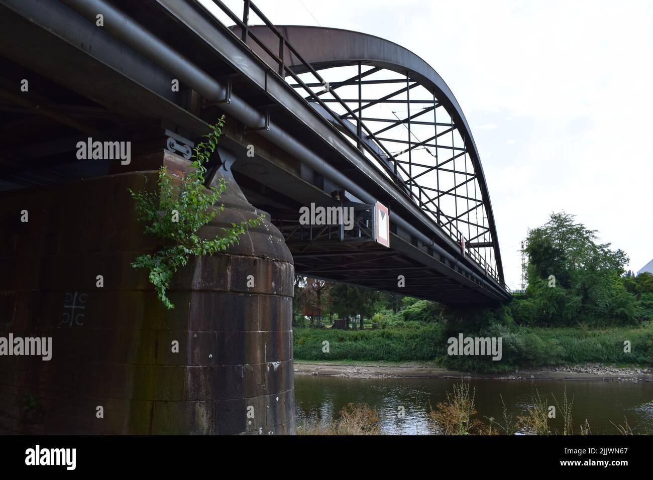 old railroad bridge built from stone and iron Stock Photo - Alamy