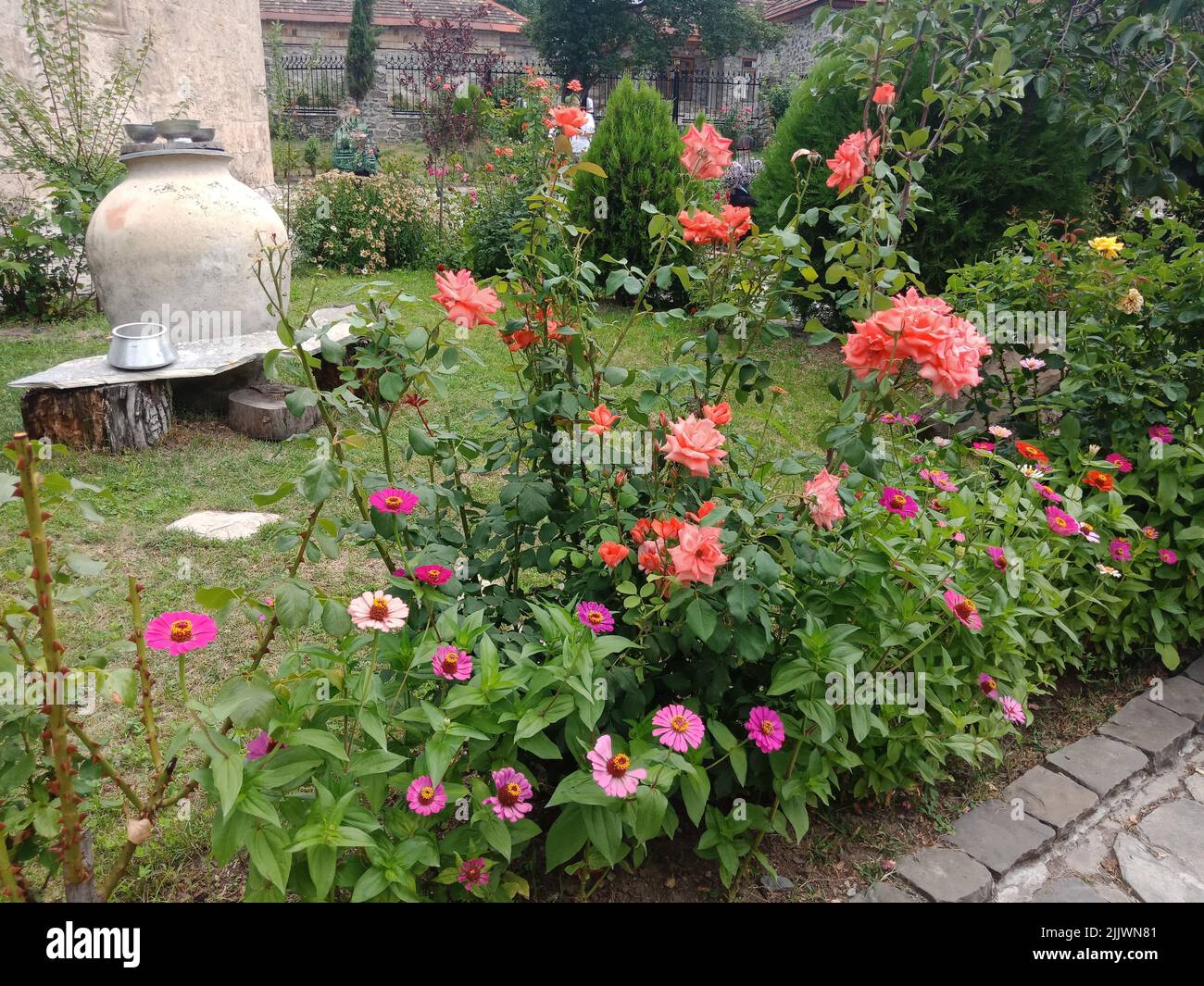 Blooming flowers in the backyard of the Albanian Temple Stock Photo - Alamy
