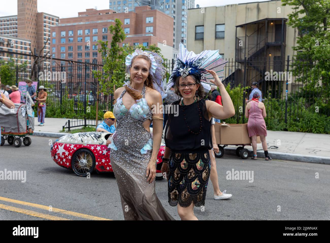 A closeup of two women in cool outfits at the 40th Annual Mermaid ...