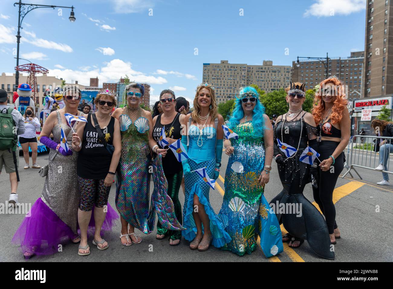 A group of women wearing cool outfits at the 40th Annual Mermaid Parade ...