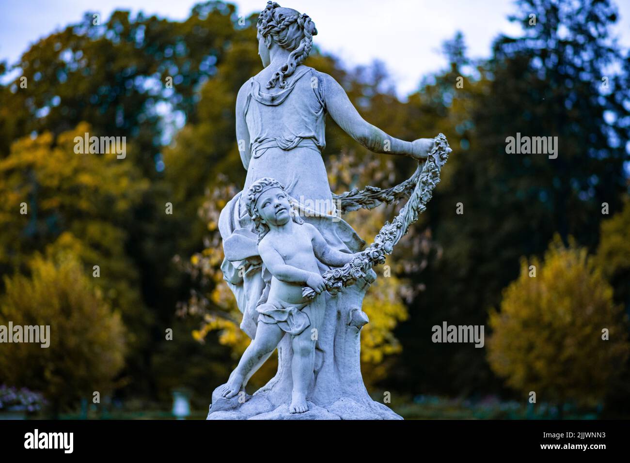 A view of the statue of the woman and baby in the park Stock Photo - Alamy