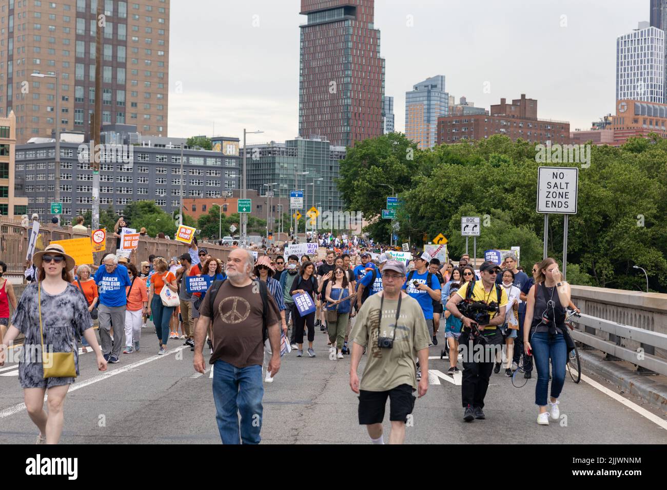 Large crowd protesting guns. Walking from Cadman Plaza in Brooklyn over ...