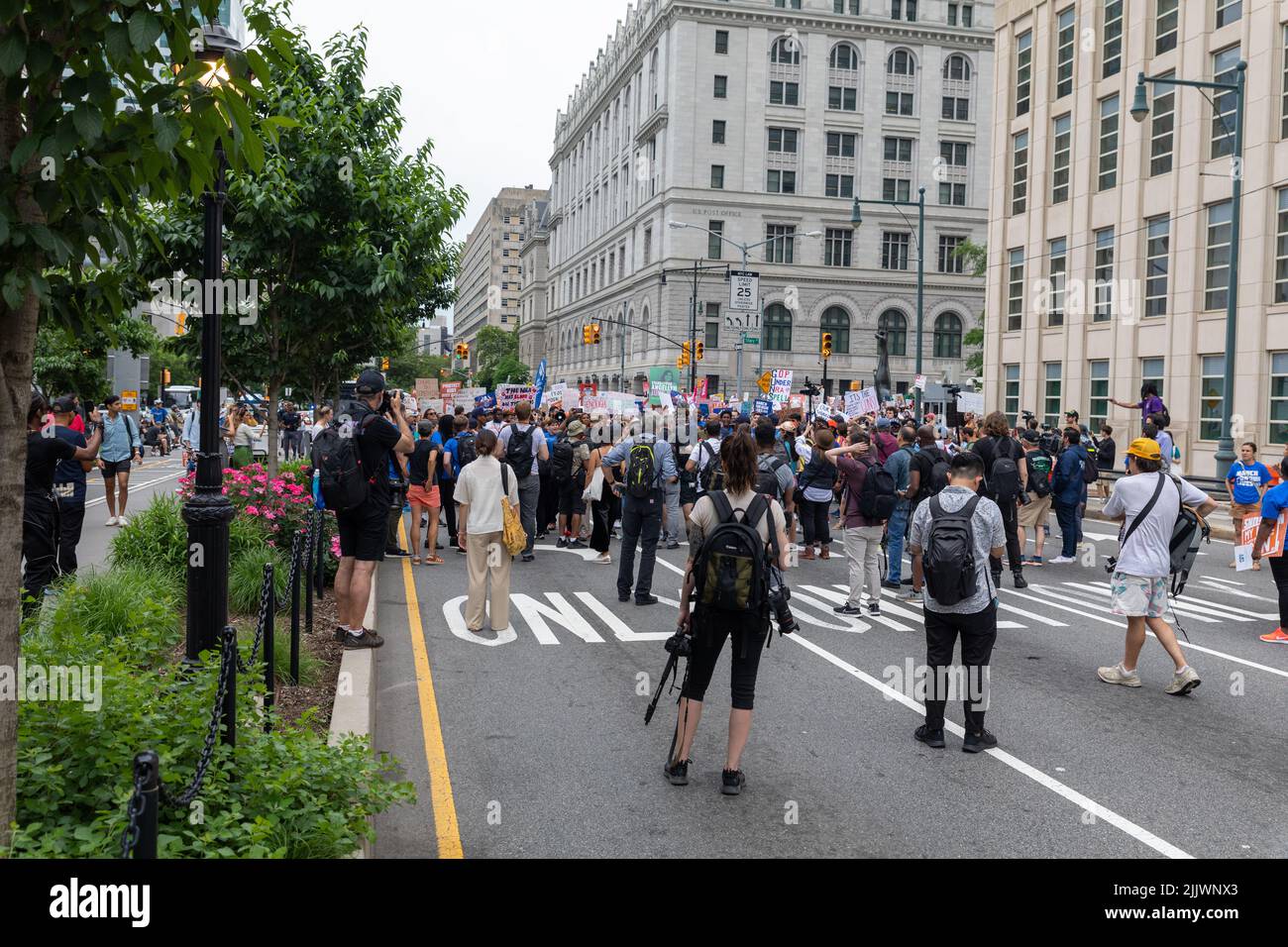 Large crowd protesting guns. Walking from Cadman Plaza in Brooklyn over ...