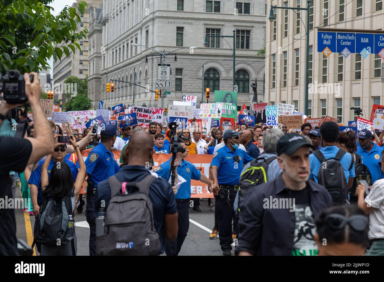 Large crowd protesting guns. Walking from Cadman Plaza in Brooklyn over ...