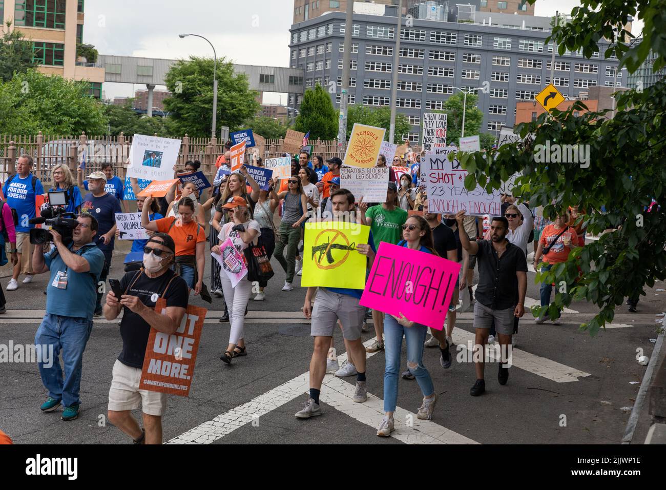 Large crowd protesting guns. Walking from Cadman Plaza in Brooklyn over ...