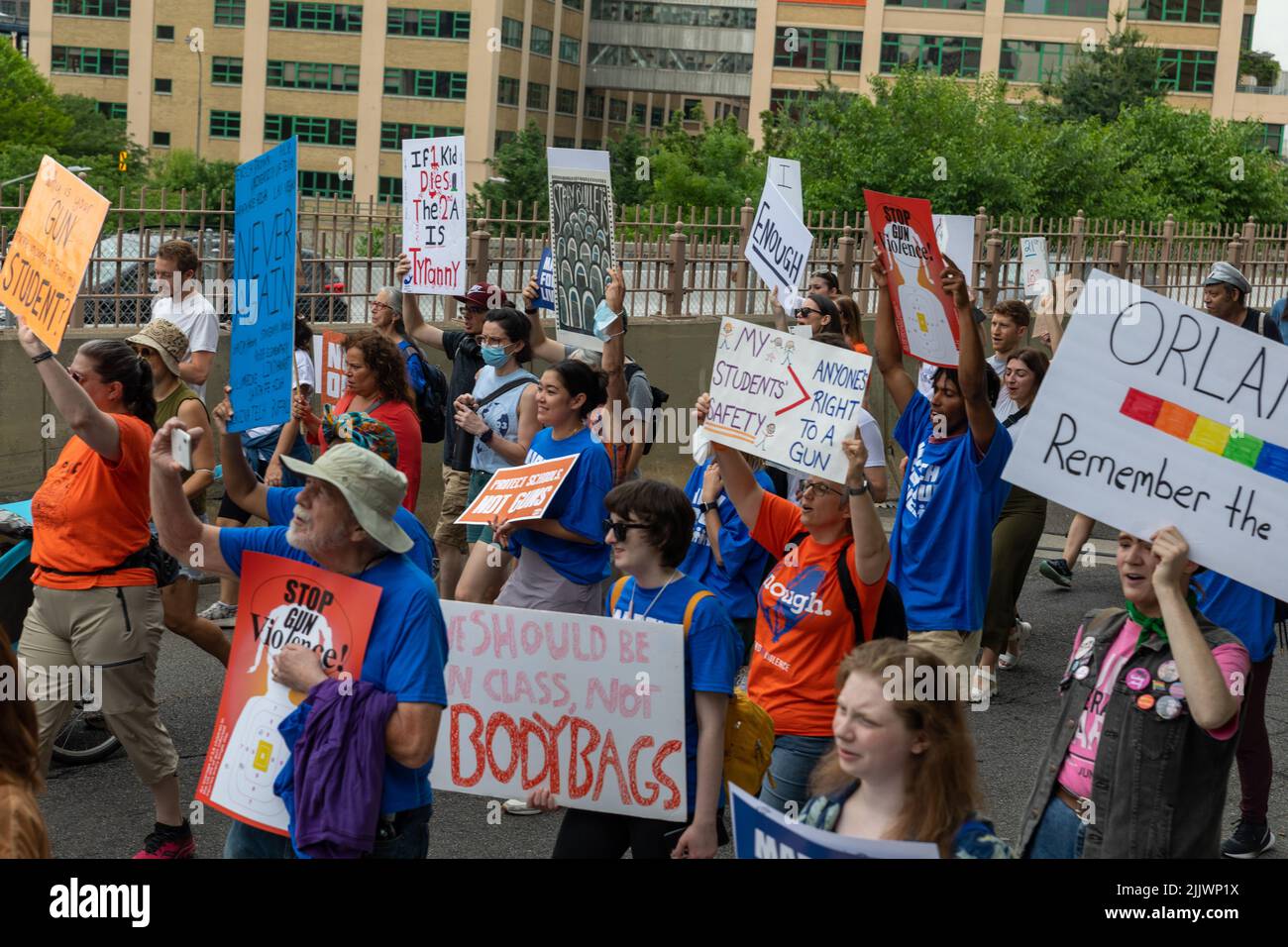 Large crowd protesting guns. Walking from Cadman Plaza in Brooklyn over ...
