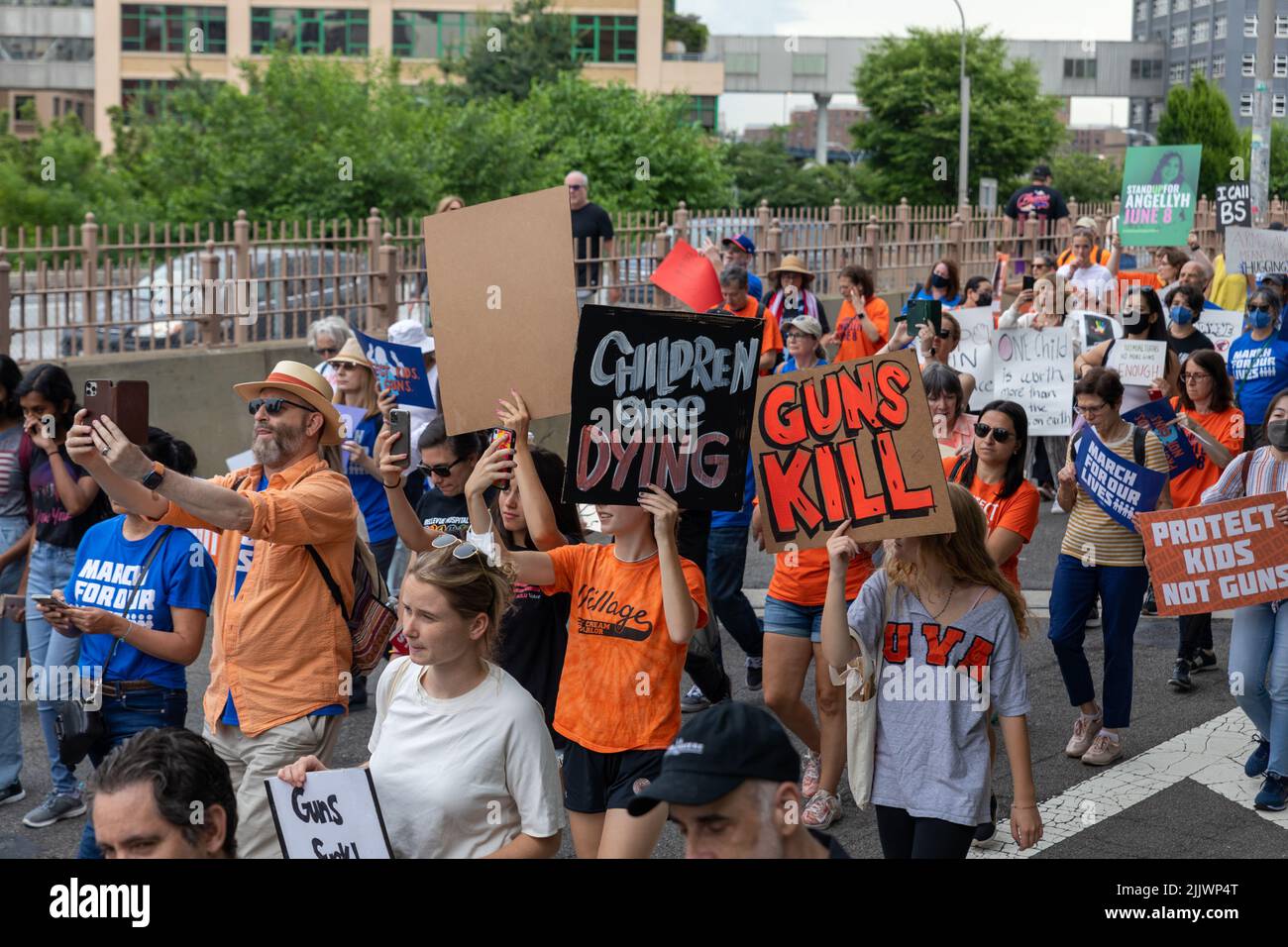 Large crowd protesting guns. Walking from Cadman Plaza in Brooklyn over ...