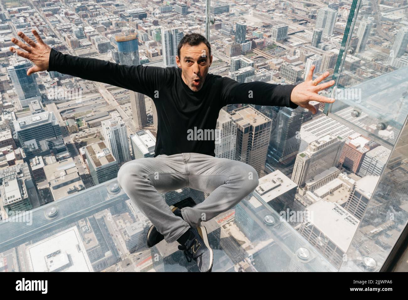 A Hispanic man sitting in the high Willi Tower in Chicago city and ...