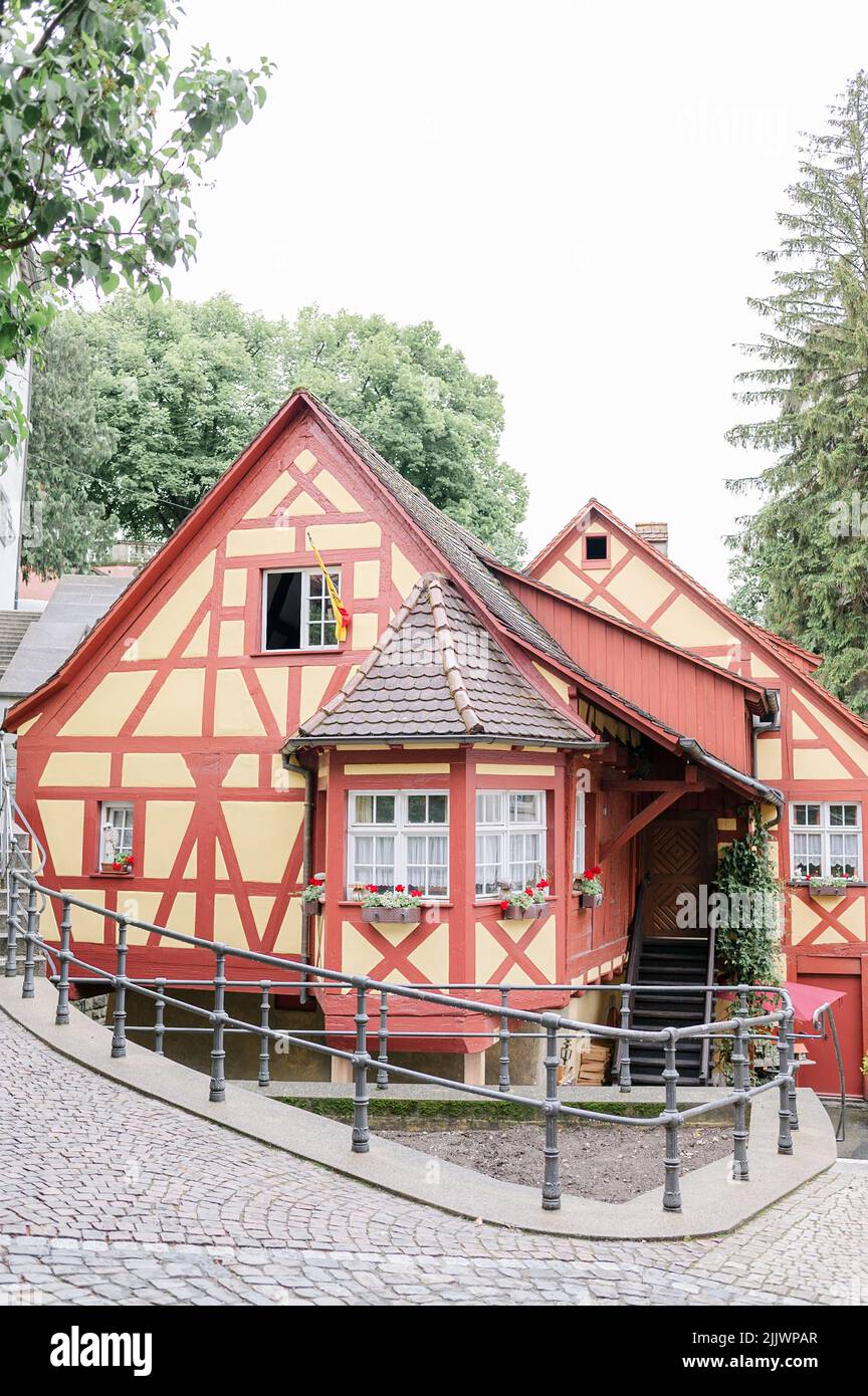 A vertical shot of the exterior design of half-timbered house with ...