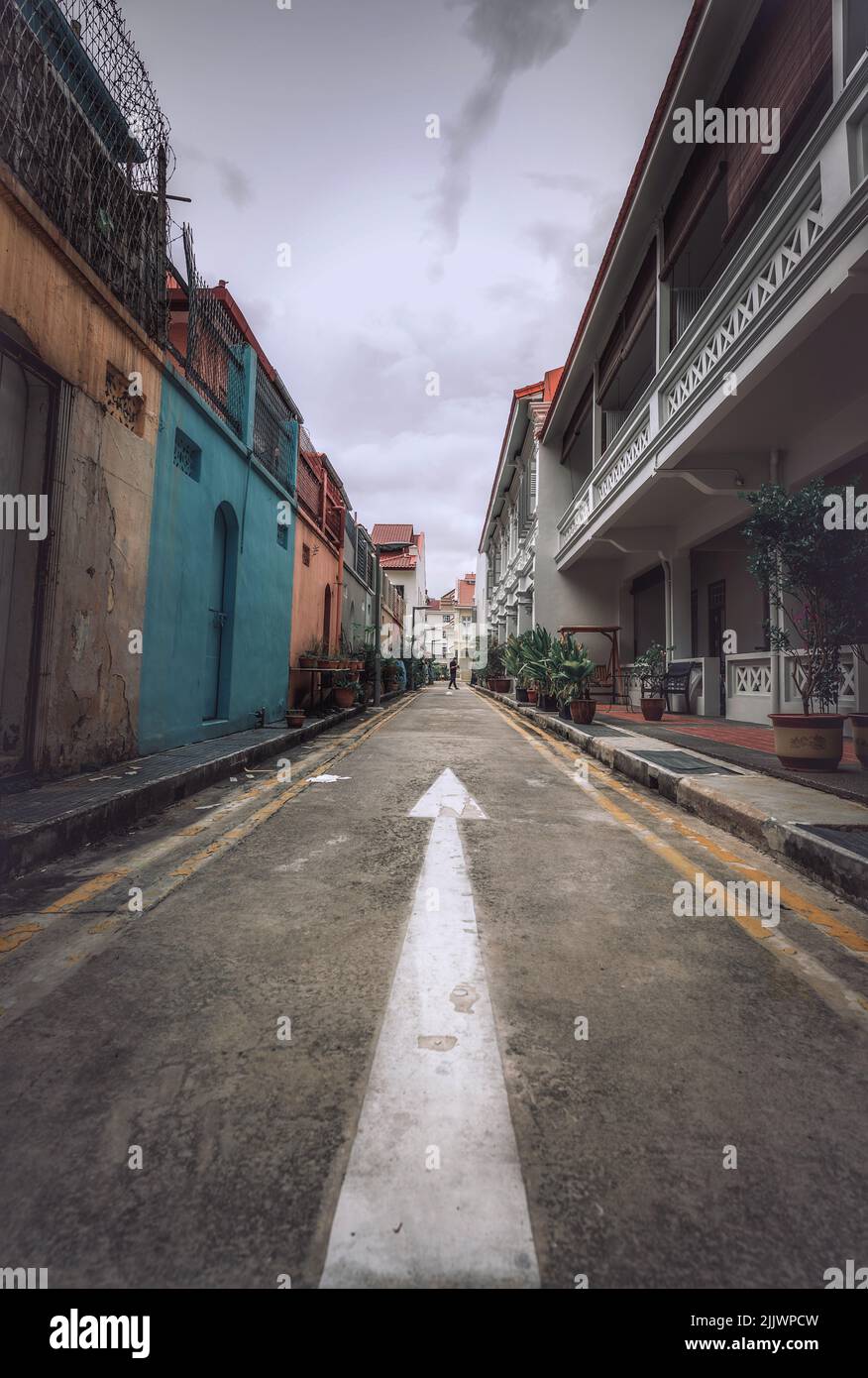 A vertical shot of a street with an arrow pointing forwards under an ...