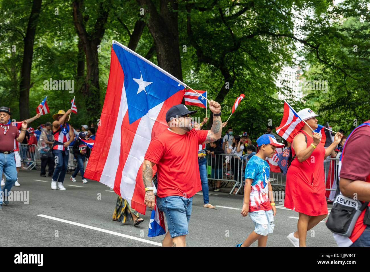 A large crowd of people coming out to celebrate the Puerto Rican Day ...