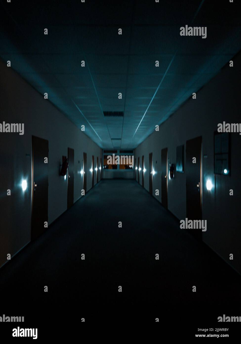 A dark creepy hallway during night time Stock Photo - Alamy