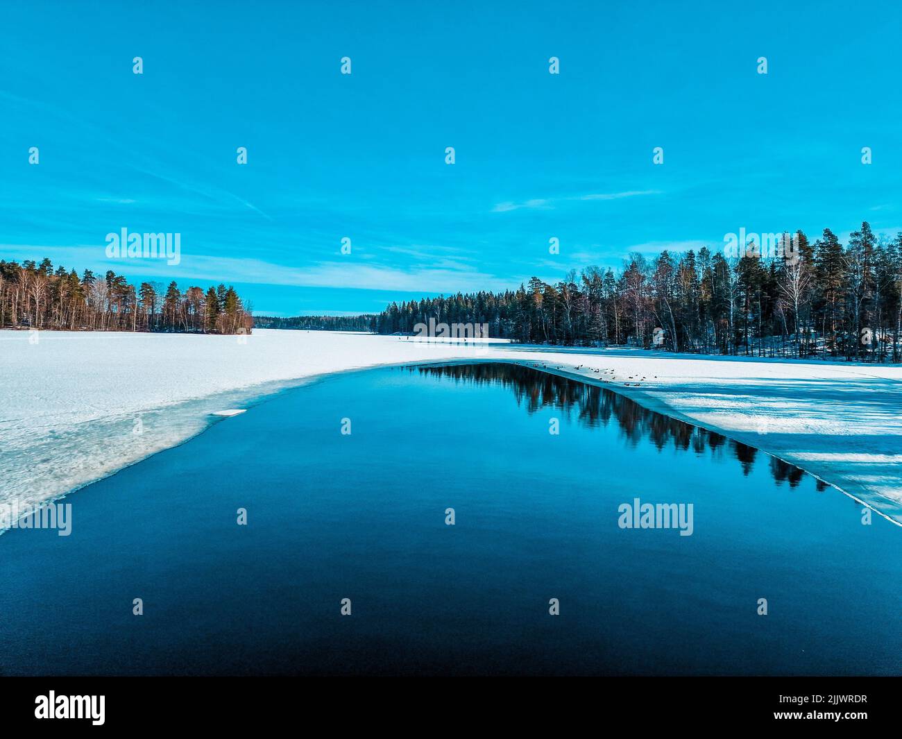 A clear water of the river covered with snow Stock Photo - Alamy