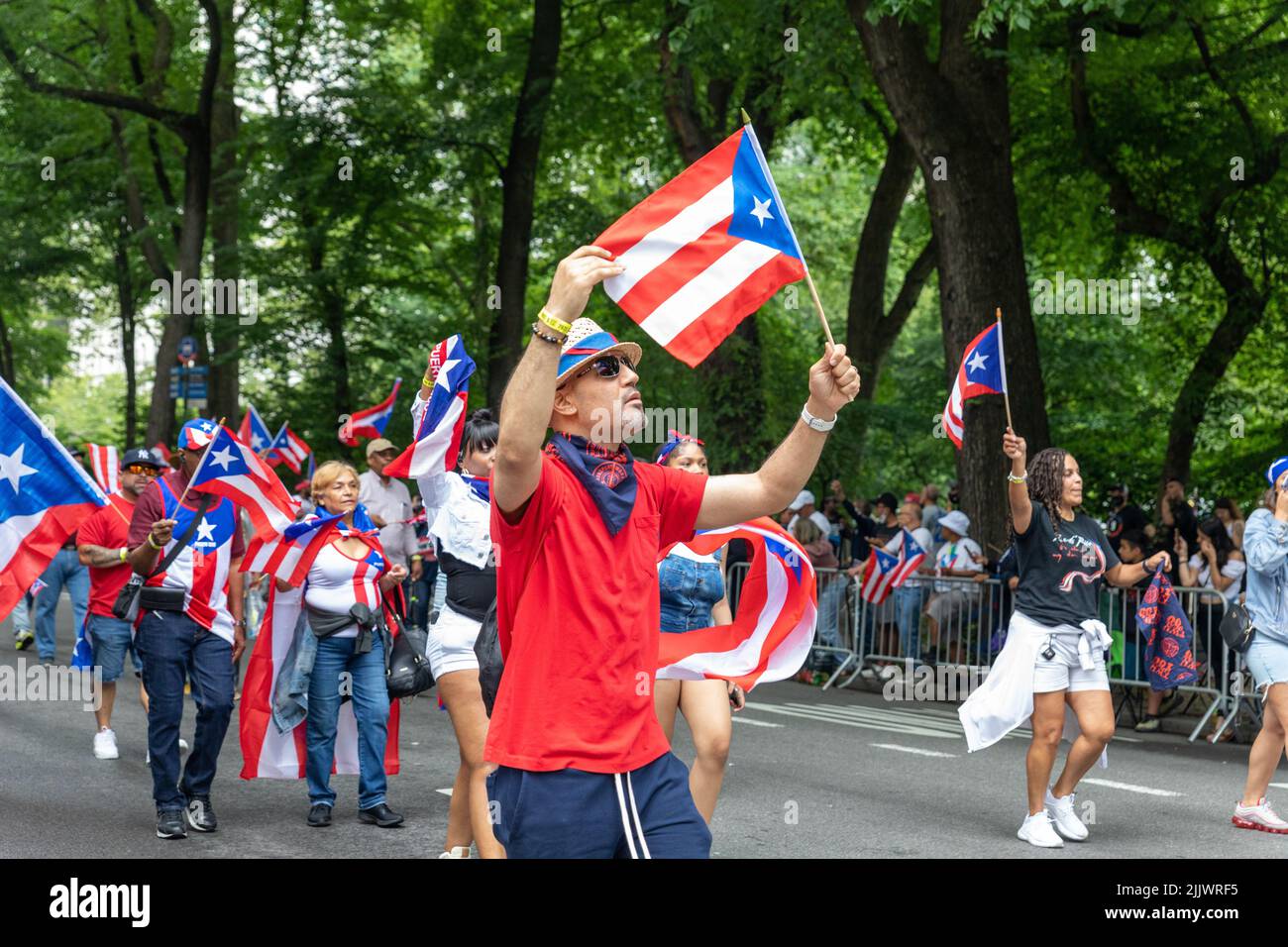 A large crowd of people coming out to celebrate the Puerto Rican Day ...