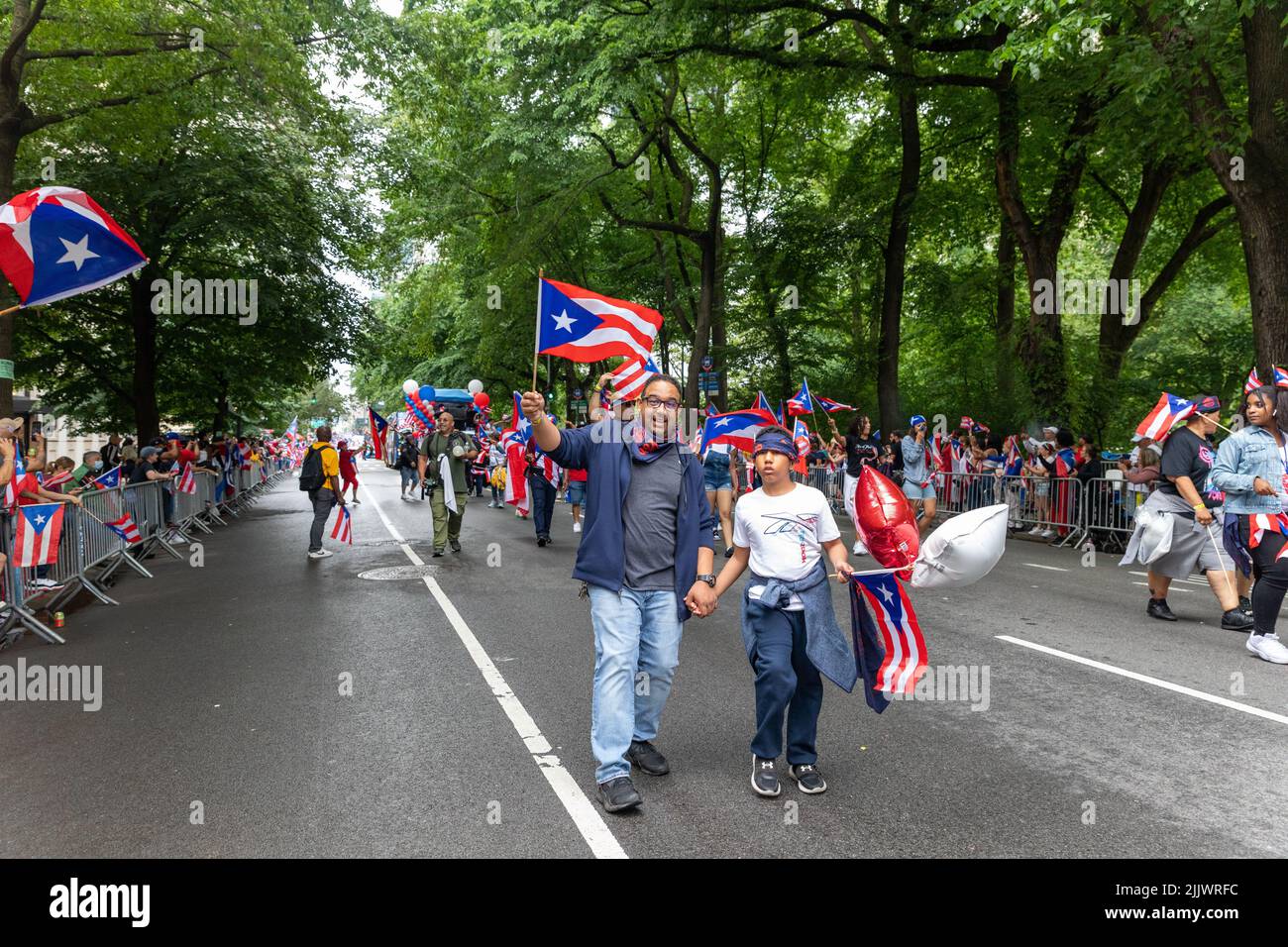 A large crowd of people coming out to celebrate the Puerto Rican Day ...